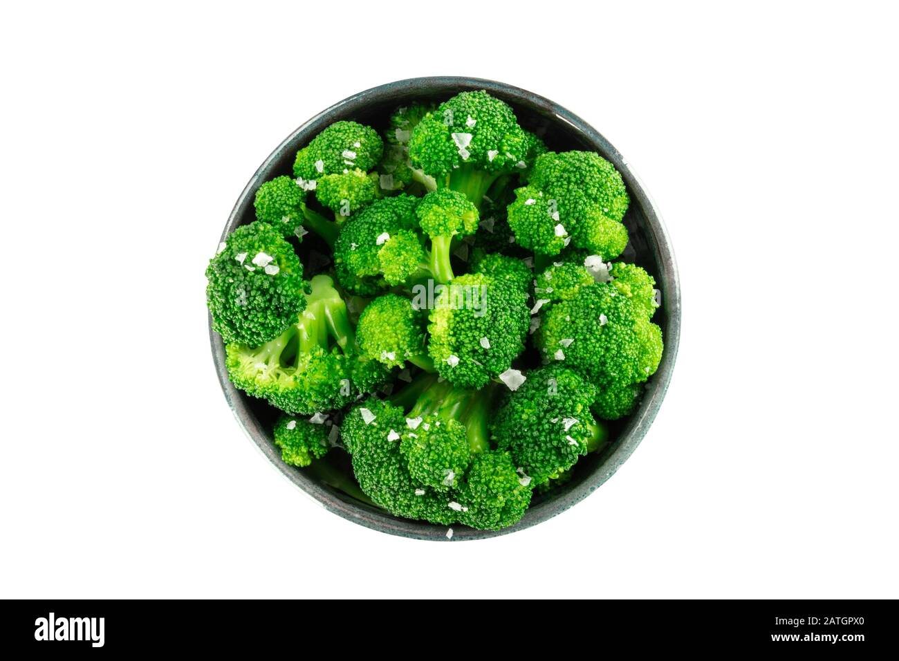 A bowl of cooked broccoli, isolated on a white background with a ...