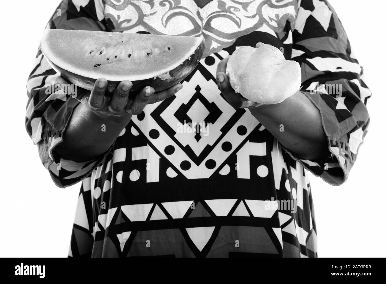 Studio shot of fat black African woman holding bread and slice of ...