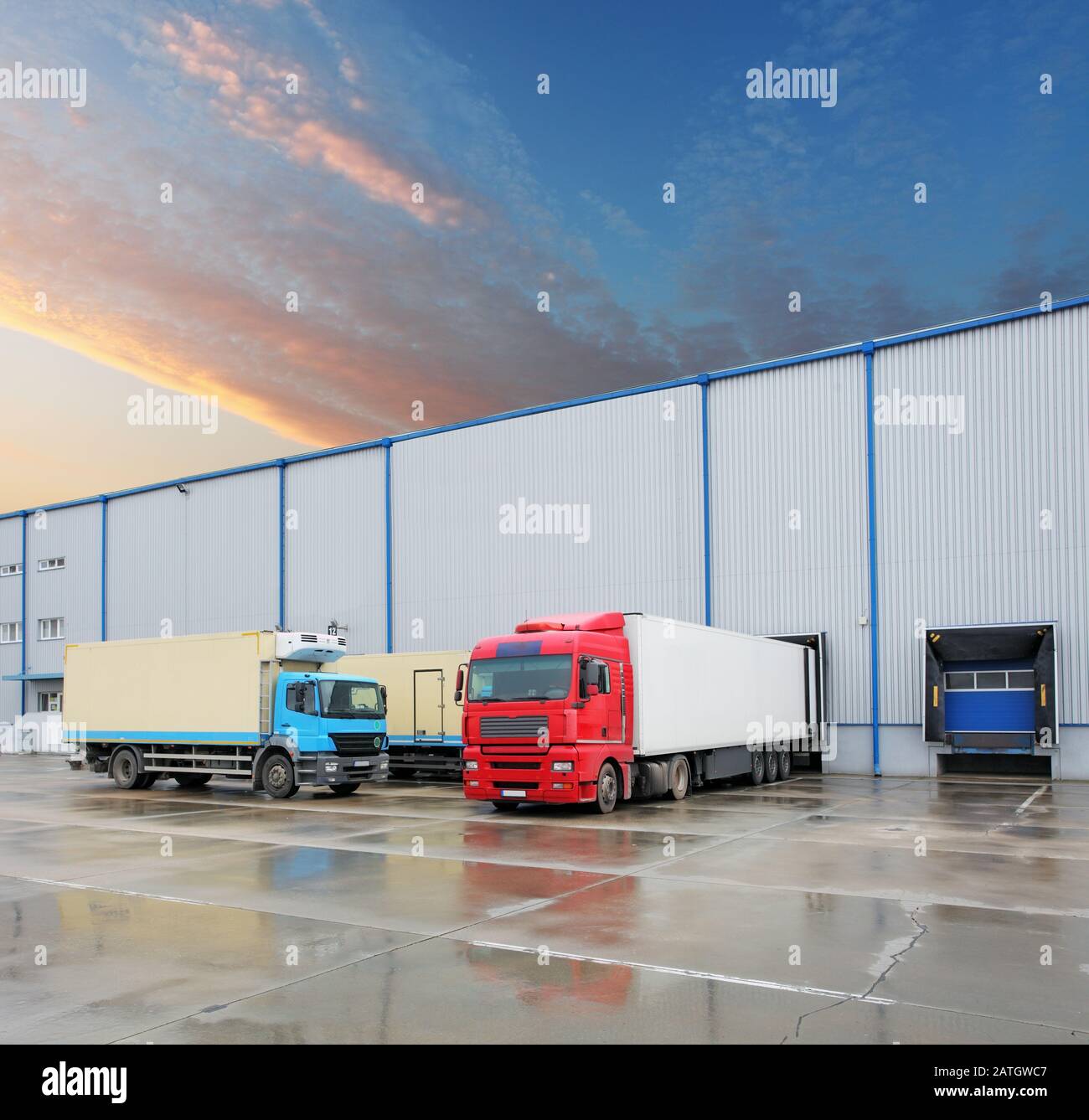 Cargo truck at warehouse building Stock Photo - Alamy