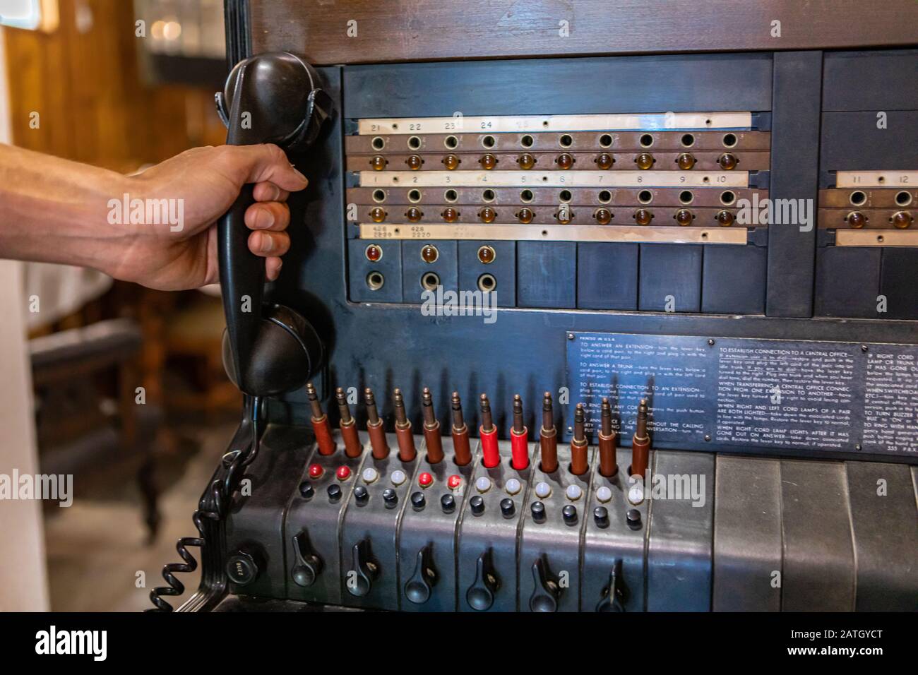 Unrecognizable man holding an old phone handset. Antique telephone ...