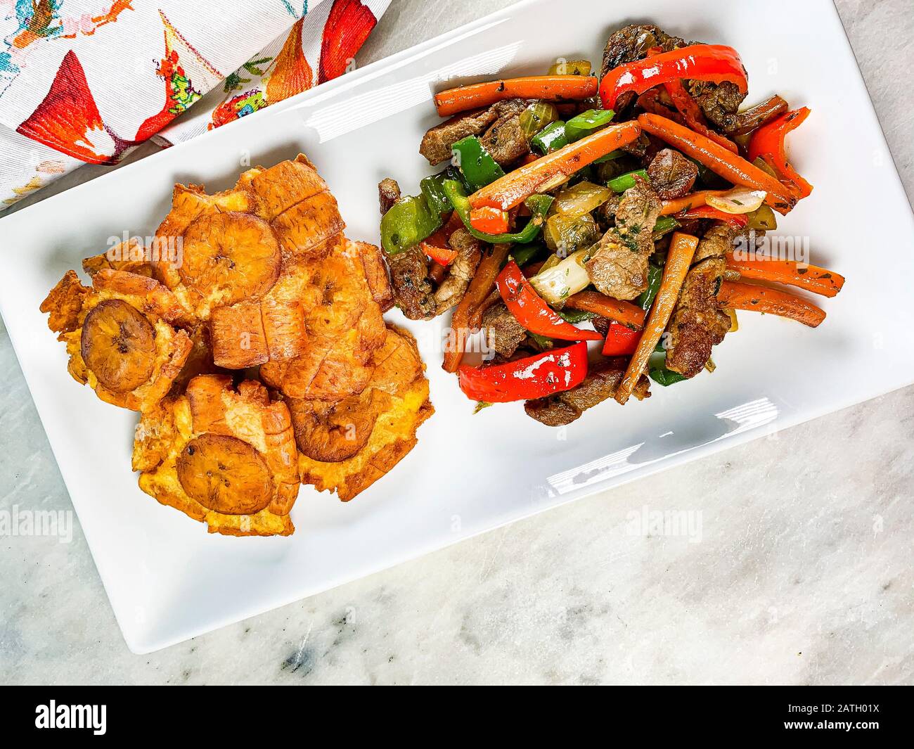 Chopped steak or Bistec Picao and patacones or tostones are fried green ...
