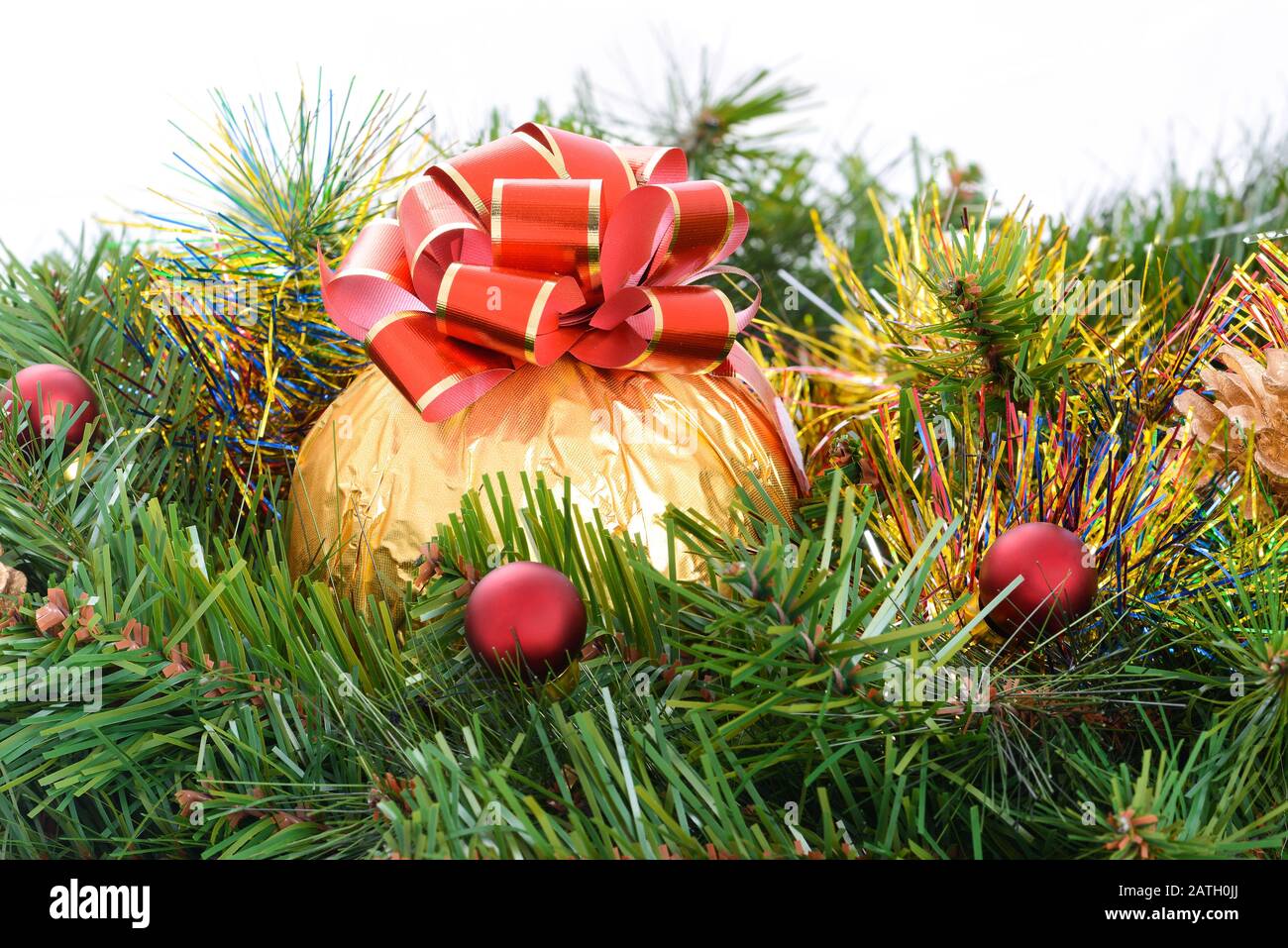 Christmas tree branches and sweets white background Stock Photo - Alamy