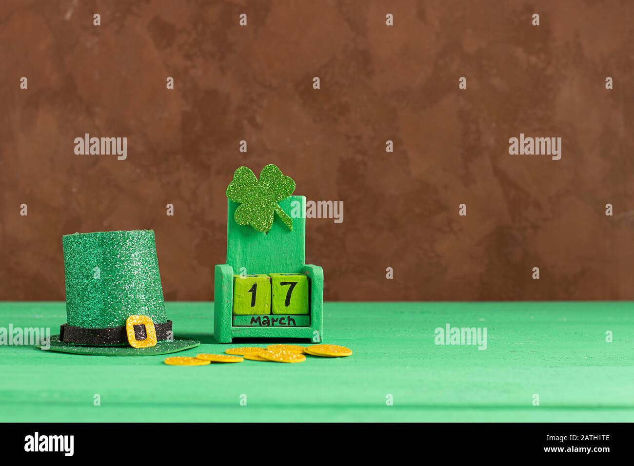 Calendar with the date March 17. Leprechaun hat and shamrock clover on ...
