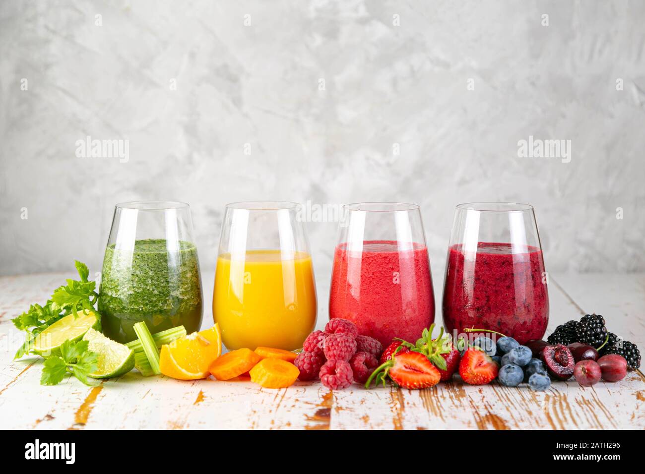 Selection of colorful smoothies in glasses Stock Photo - Alamy