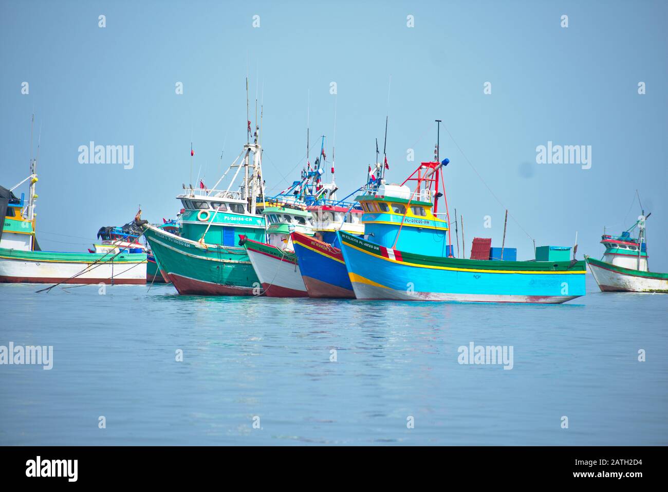 Colorful pastel fishing boats floating in the ocean in Paracas Stock ...