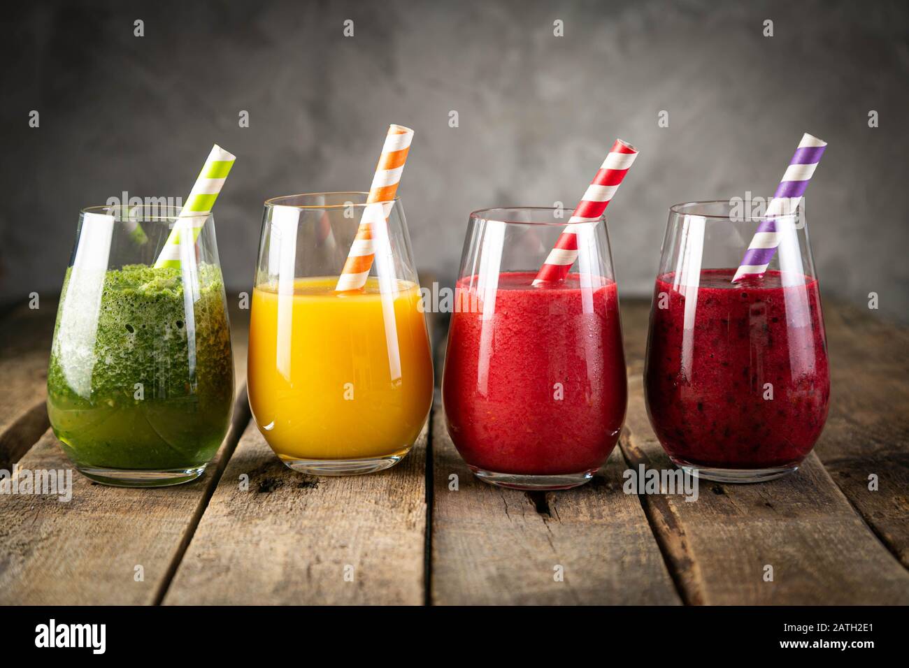 Selection of colorful smoothies in glasses Stock Photo - Alamy