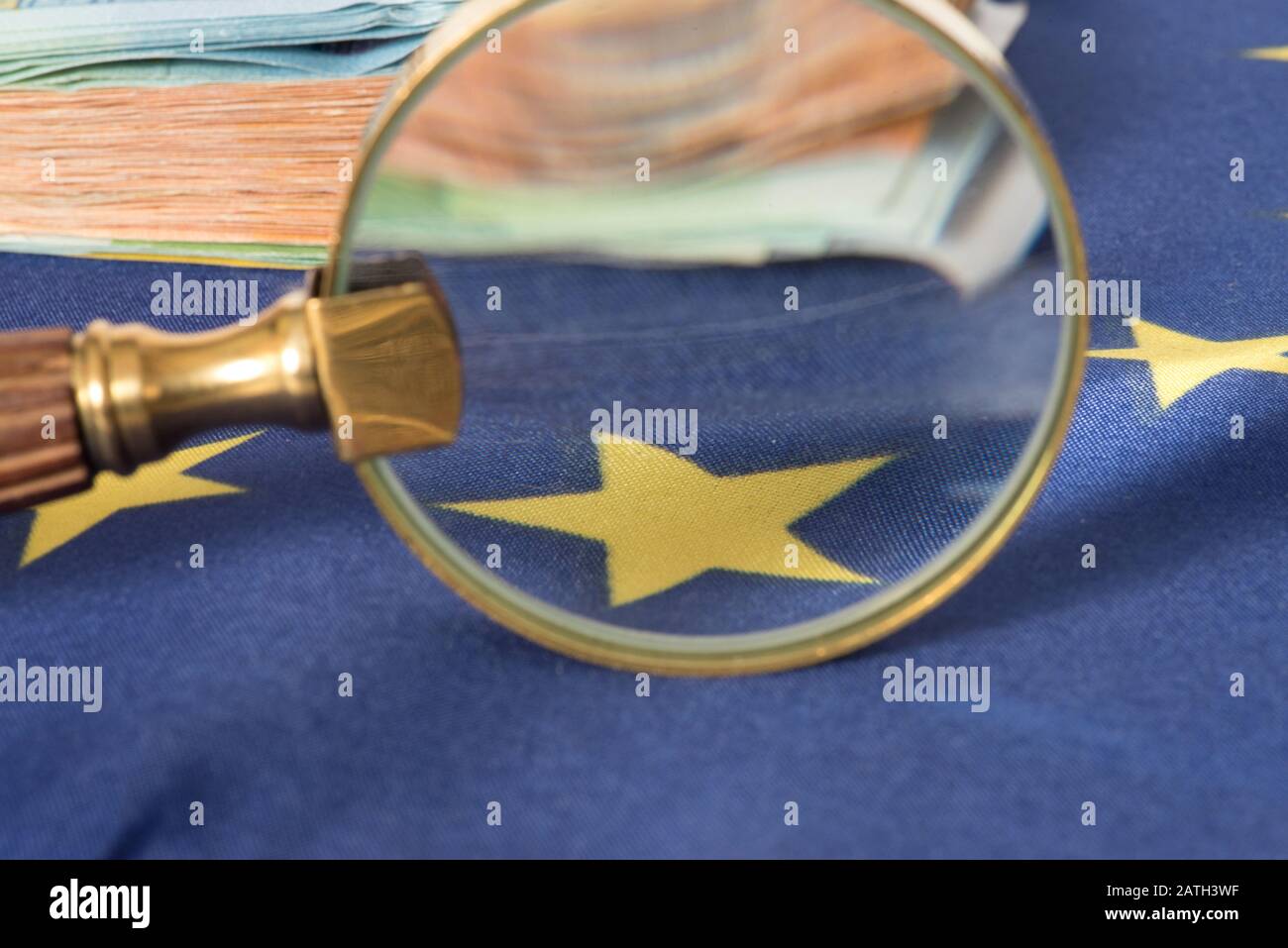 European Union flag EU, a magnifying glass and euro banknotes Stock ...