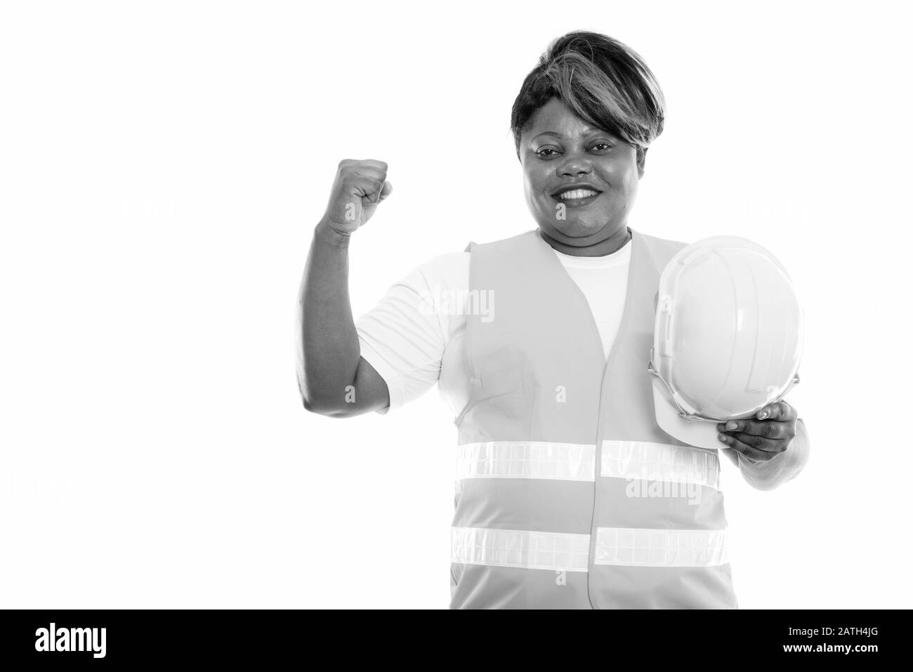 Studio shot of overweight African woman construction worker Stock Photo ...