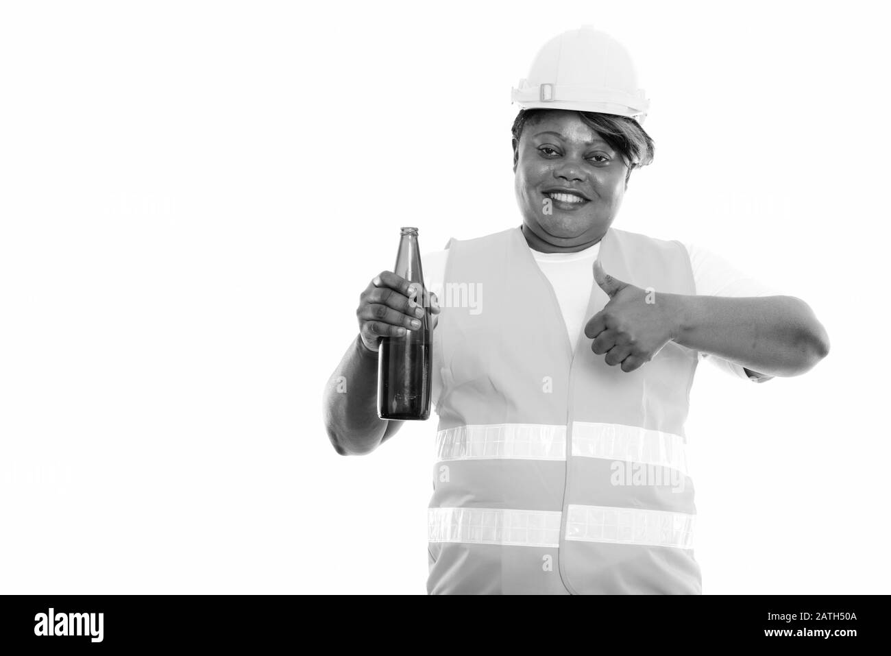 Studio shot of overweight African woman construction worker Stock Photo ...