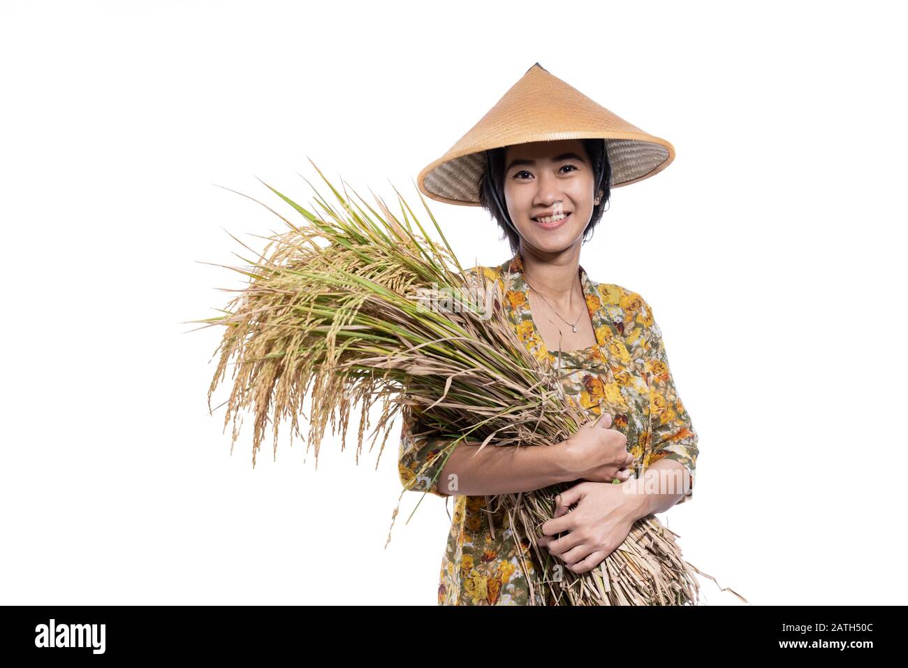portrait of asian beautiful farmer holding rice grain isolated over ...