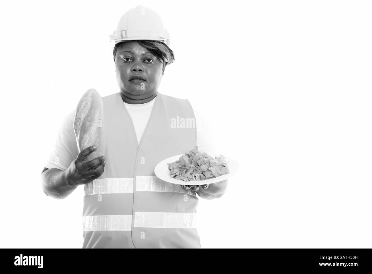 Studio shot of overweight African woman construction worker Stock Photo ...
