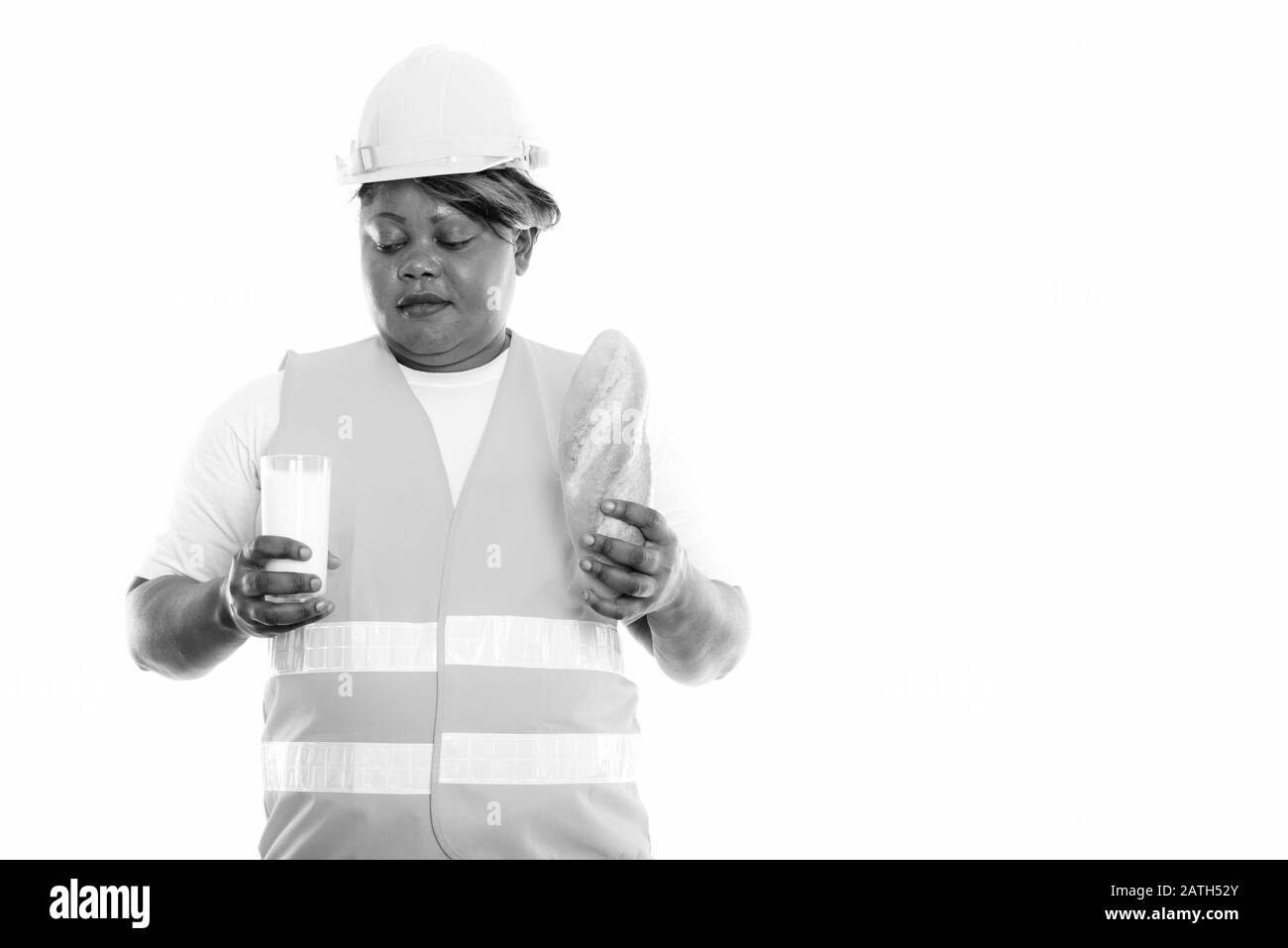 Studio shot of overweight African woman construction worker Stock Photo ...