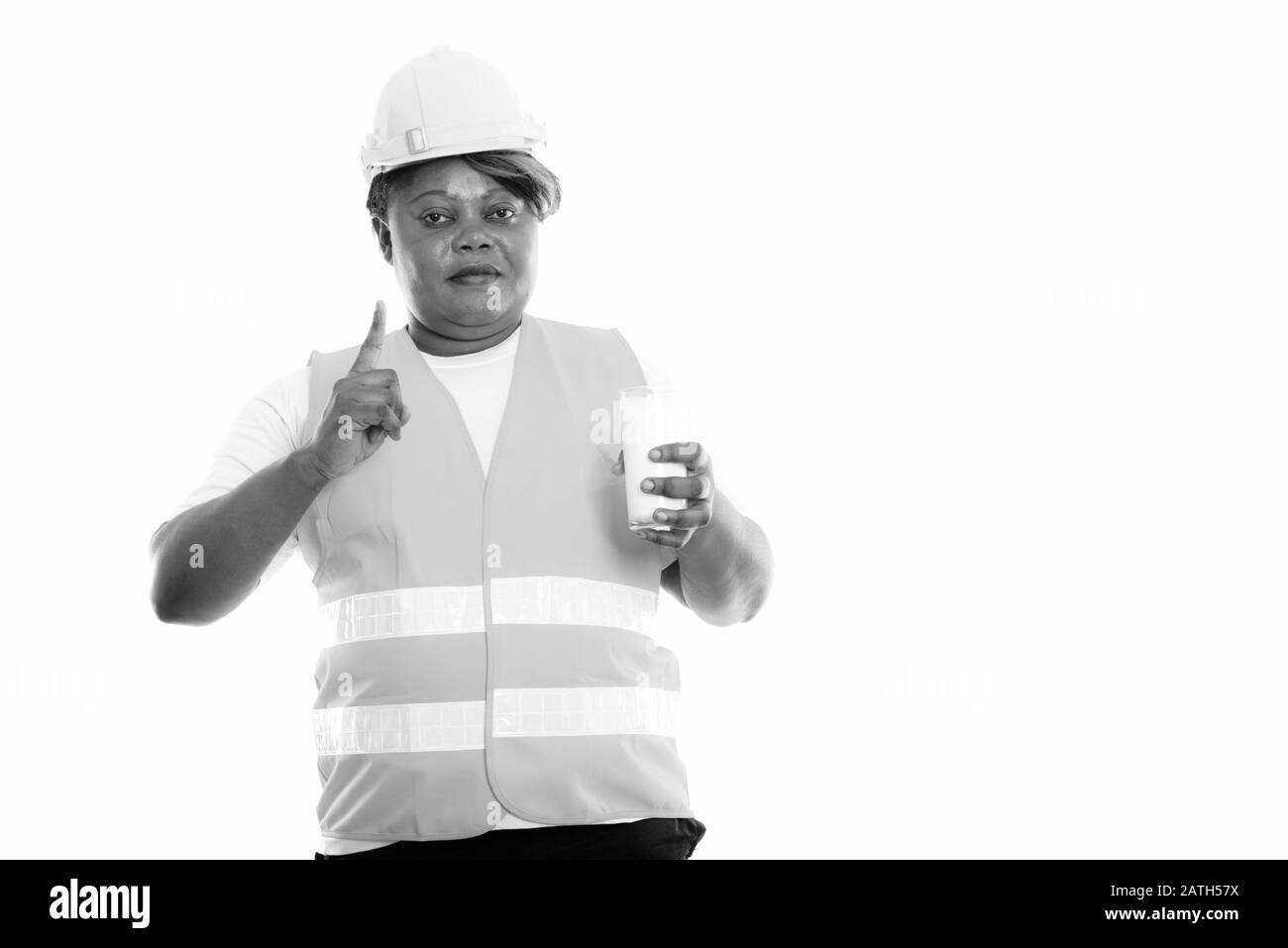 Studio shot of overweight African woman construction worker Stock Photo ...