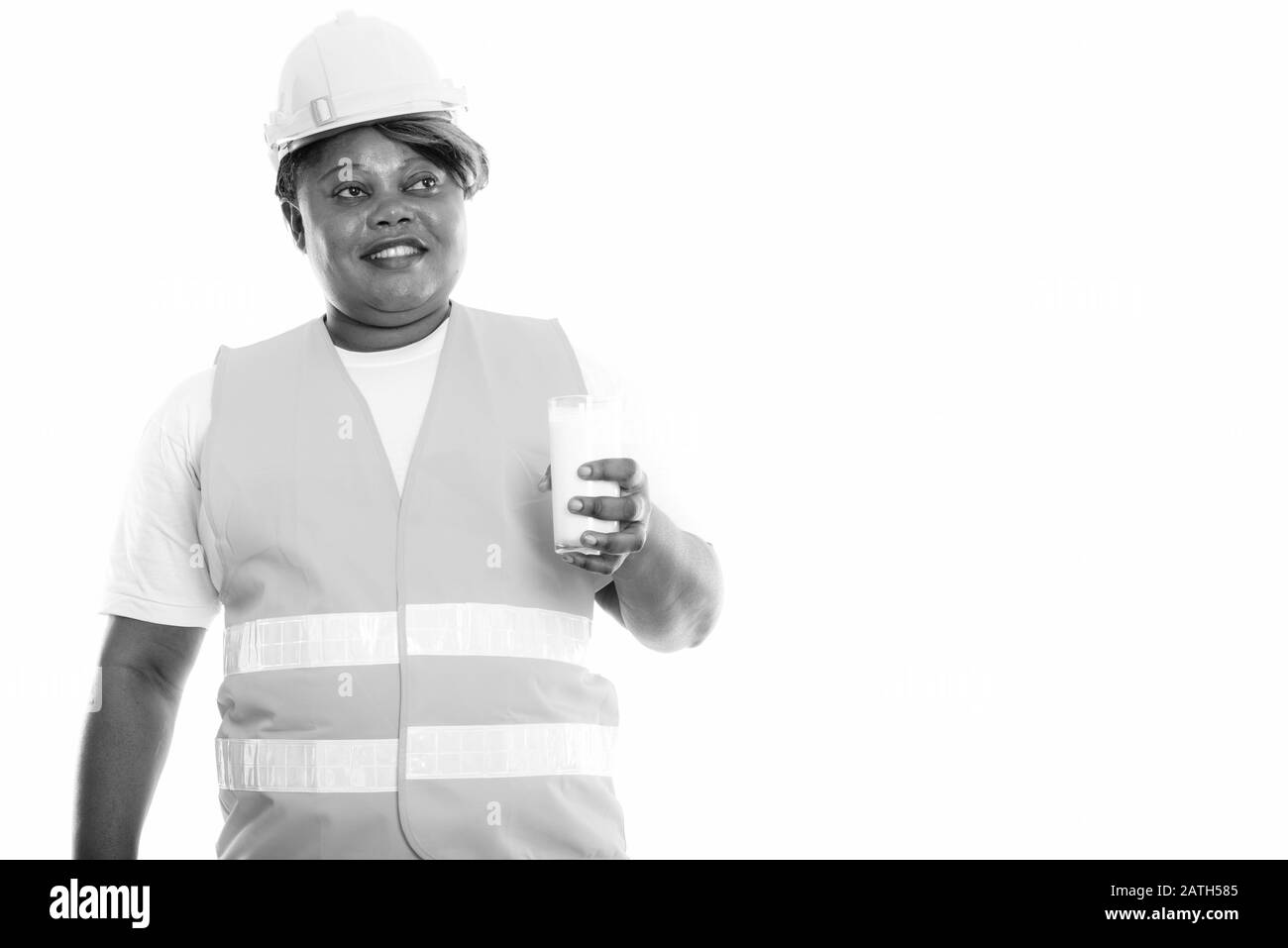 Studio shot of overweight African woman construction worker Stock Photo ...