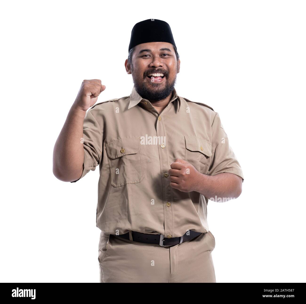 excited male worker wearing brown uniform raised his arm. pegawai ...