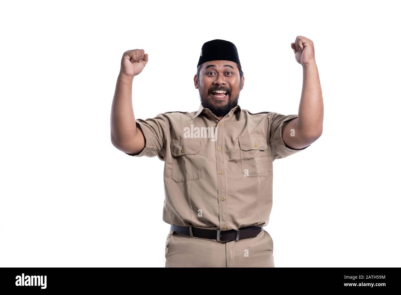 excited male worker wearing brown uniform raised his arm. pegawai ...