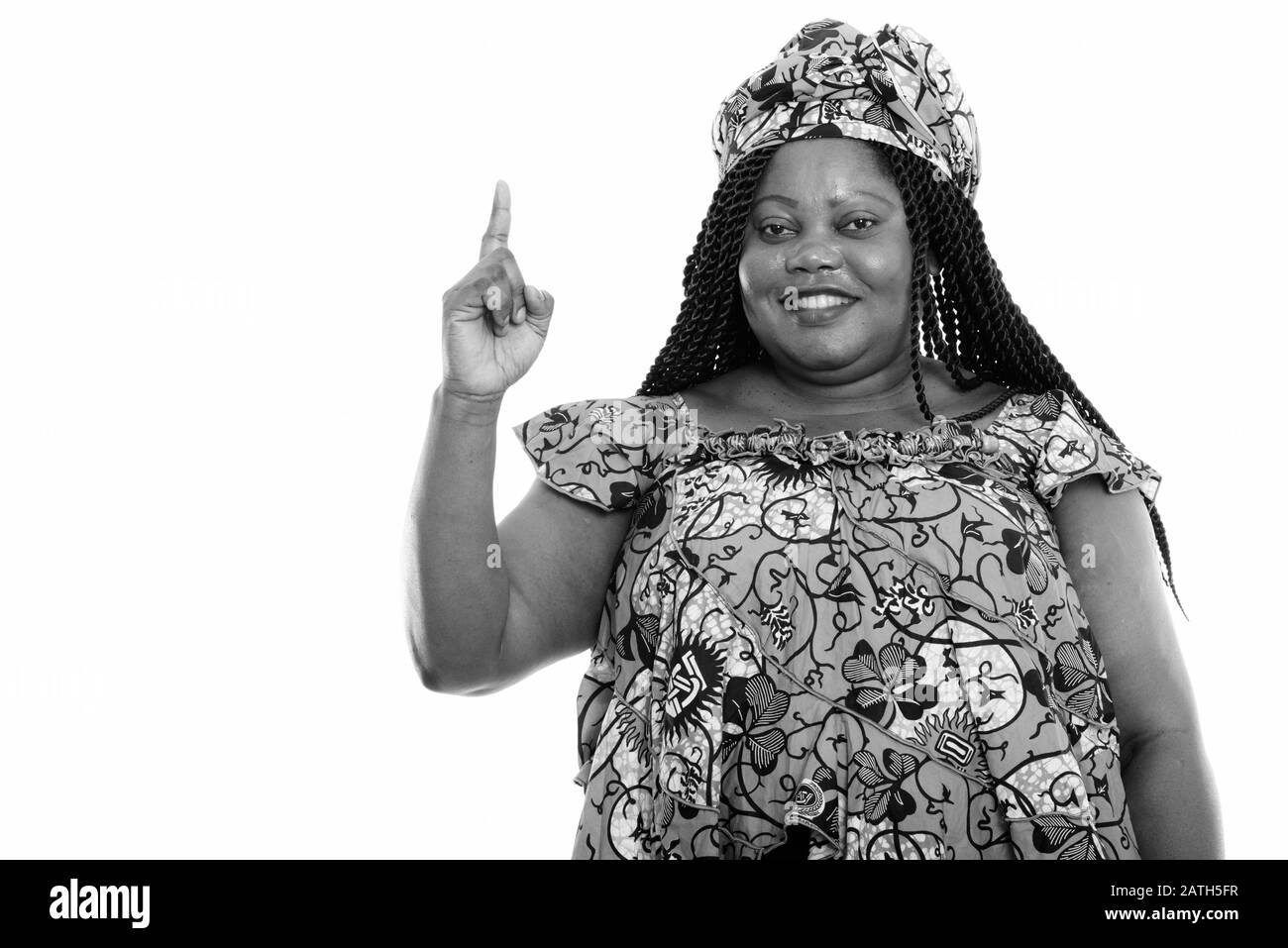 Portrait of beautiful overweight African woman with traditional clothes ...