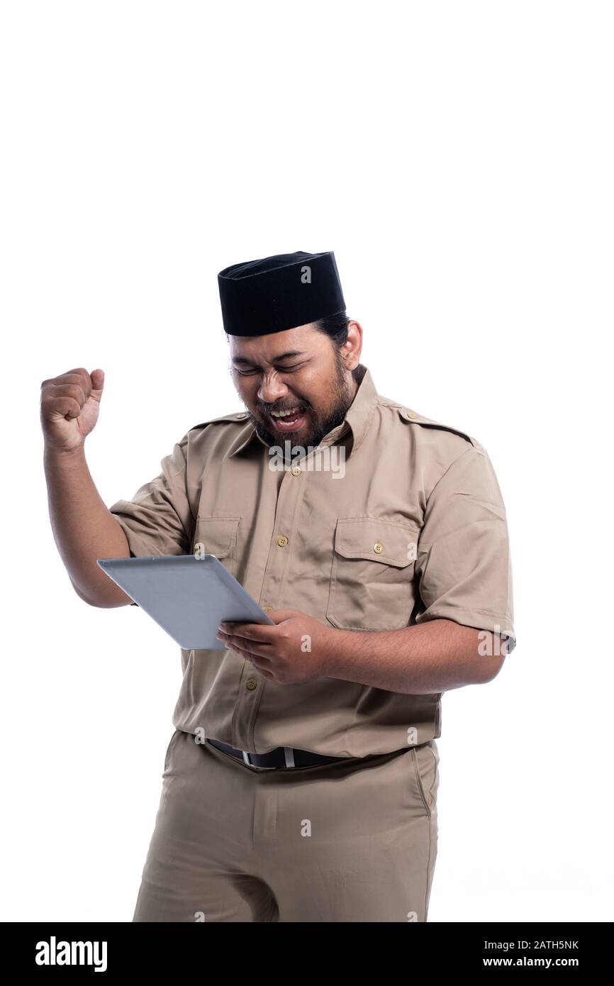 happy indonesian government worker using tabletp pc. businessman using ...