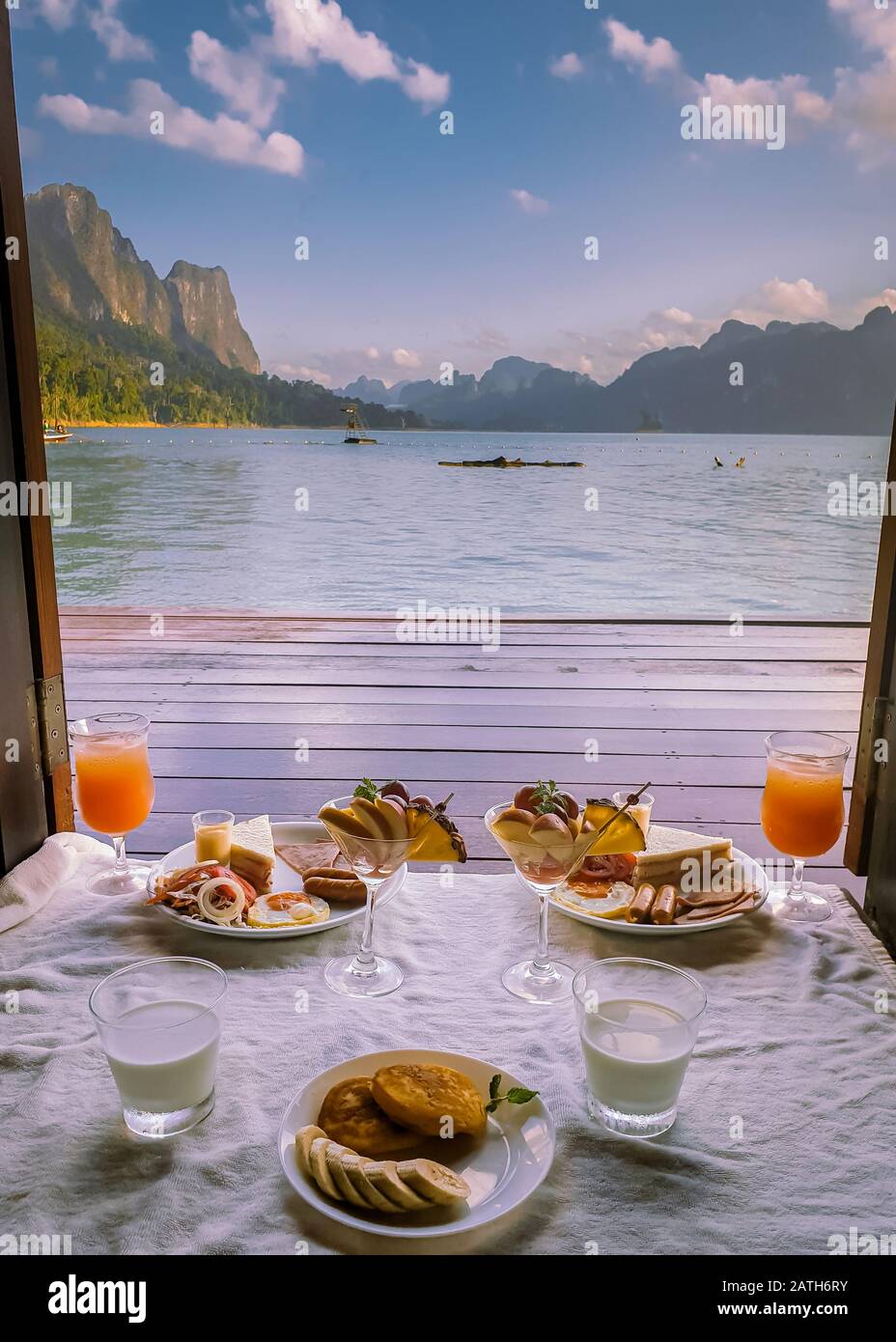 breakfast in front of floating wooden bungalow on the lake Khao Sok ...