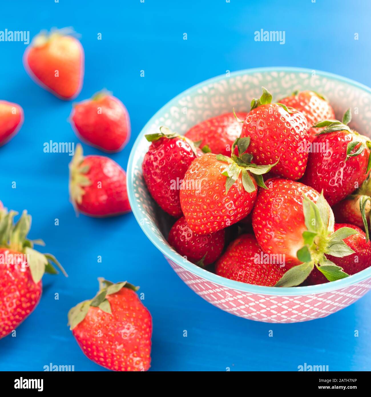 Fresh strawberries in bowl isolated on white background Stock Photo - Alamy