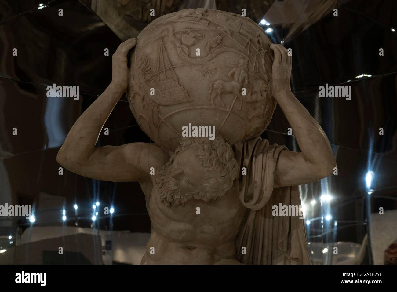 Atlas holding the earth globe marble statue Stock Photo - Alamy