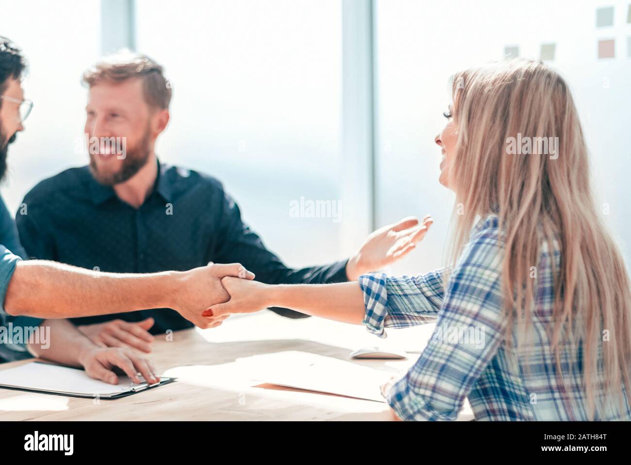 Interviewer handshaking the applicant hi-res stock photography and ...