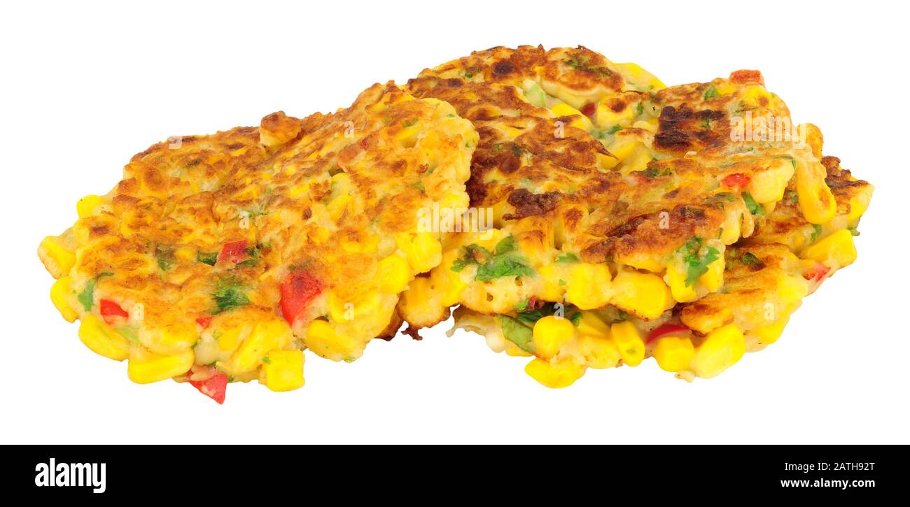 Fried sweetcorn and chilli pepper fritters isolated on a white ...