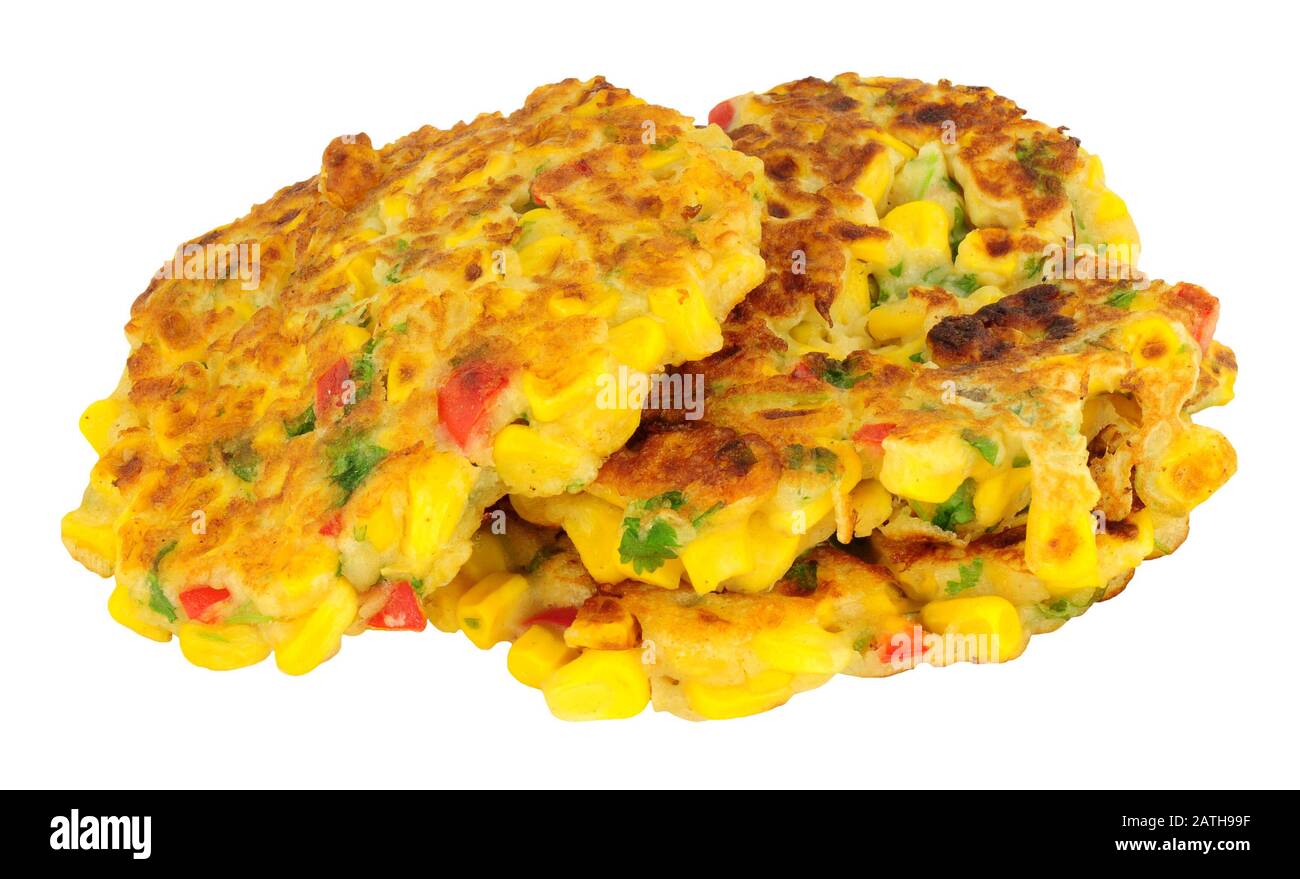 Fried sweetcorn and chilli pepper fritters isolated on a white ...