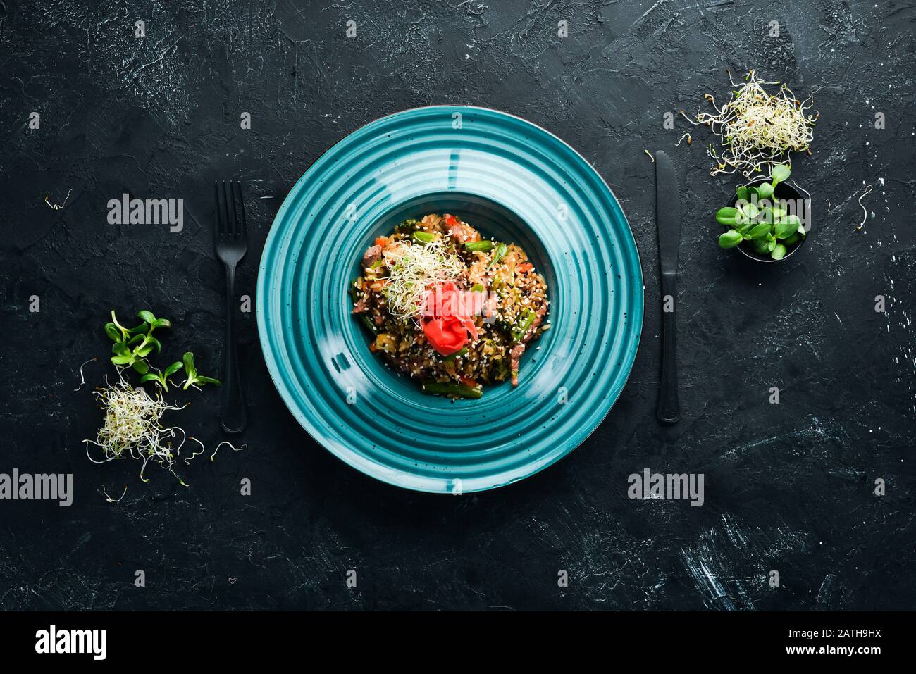 Risotto with veal and vegetables. Rice. In the plate. Top view. Free ...