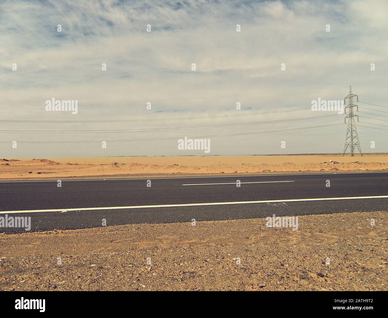 scene of a road through desert Stock Photo - Alamy