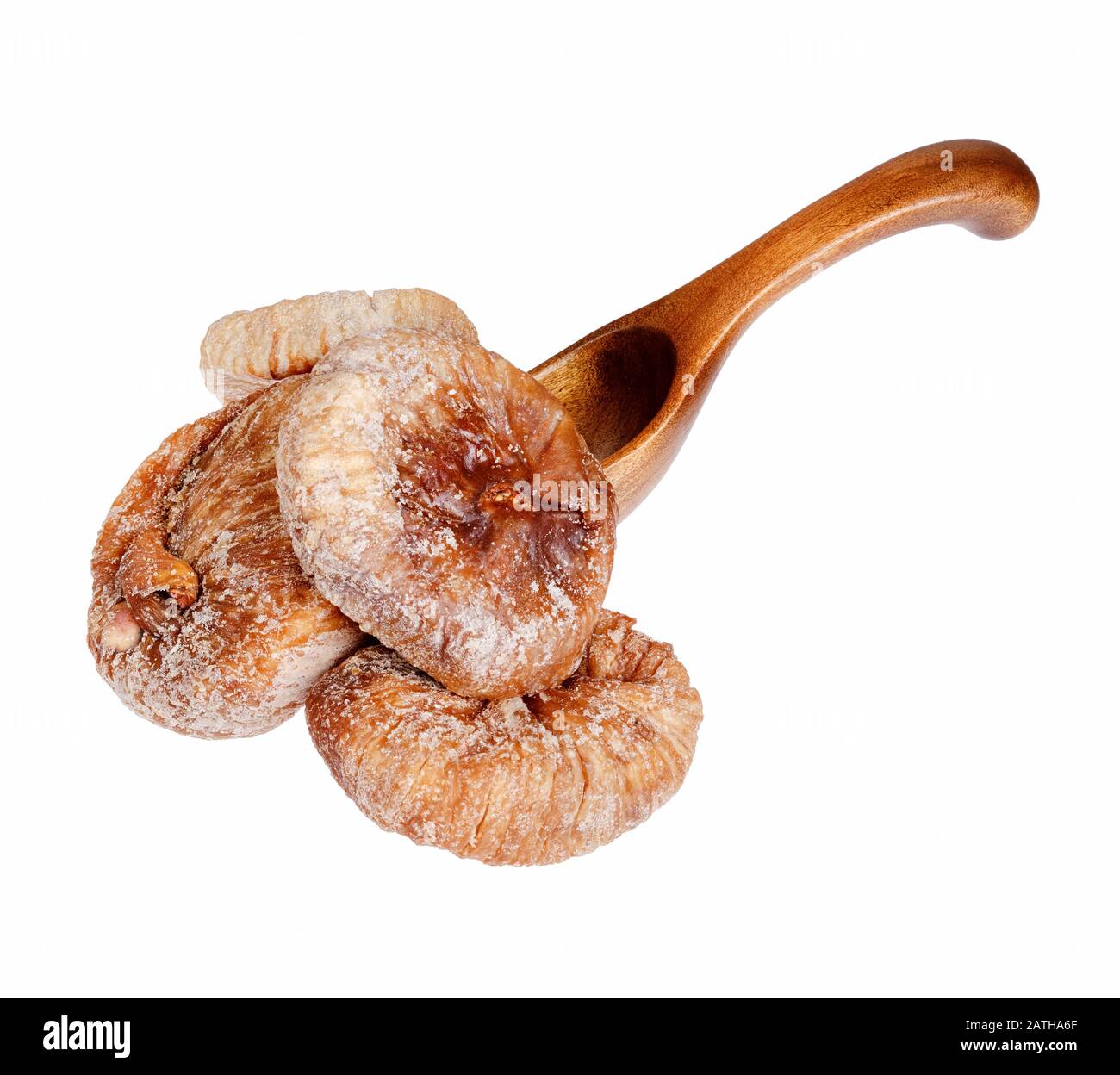 Dried fig fruits in the wooden spoon, isolated on white background ...