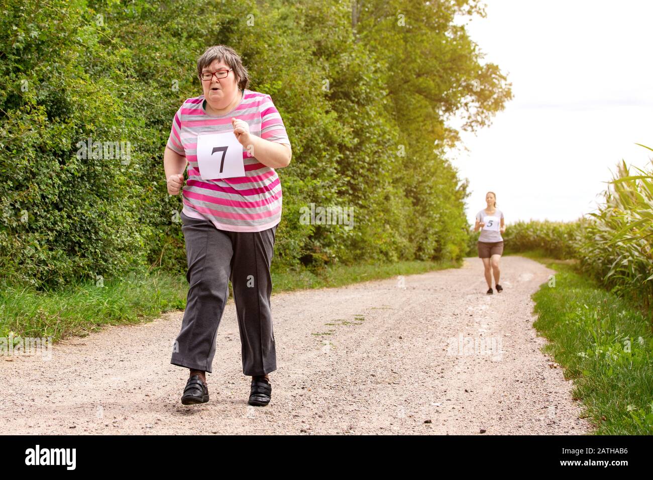 mental disabled woman is jogging or running in a fun competition ...