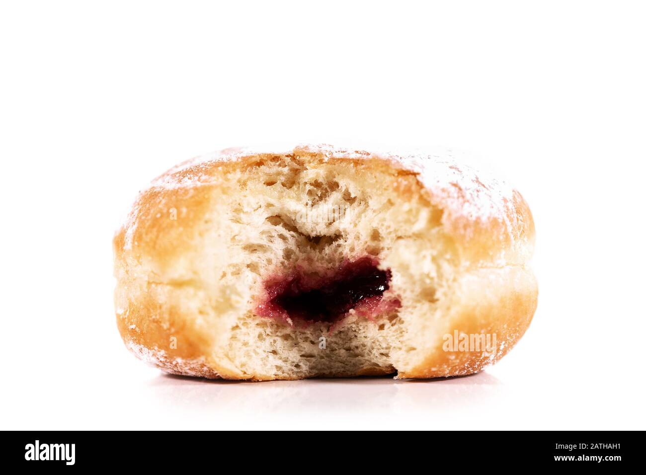 Bitten off Berliner or donut, isolated against white background Stock ...
