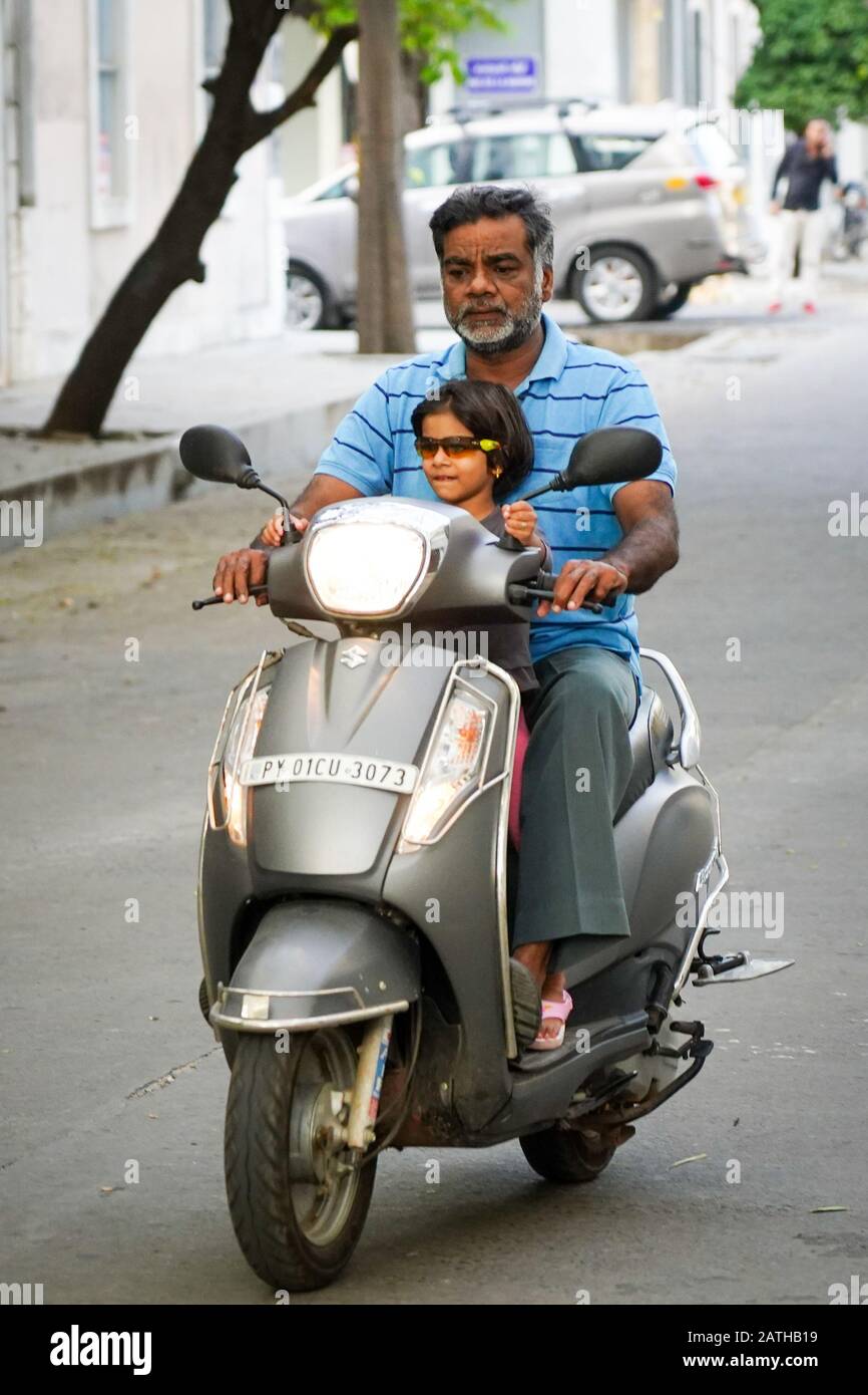 Views of riders of motorcycles and mopeds in Pondicherry. From a series ...