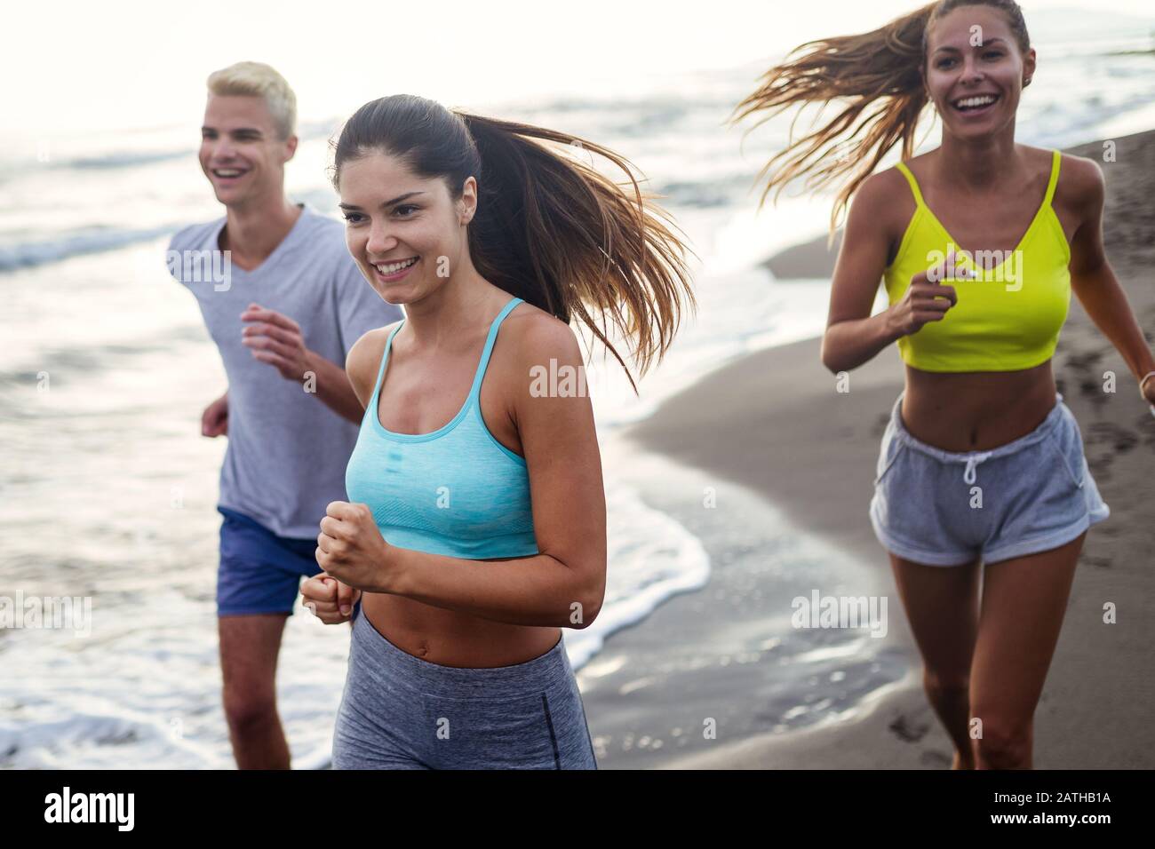 Group exercise on beach hi-res stock photography and images - Alamy