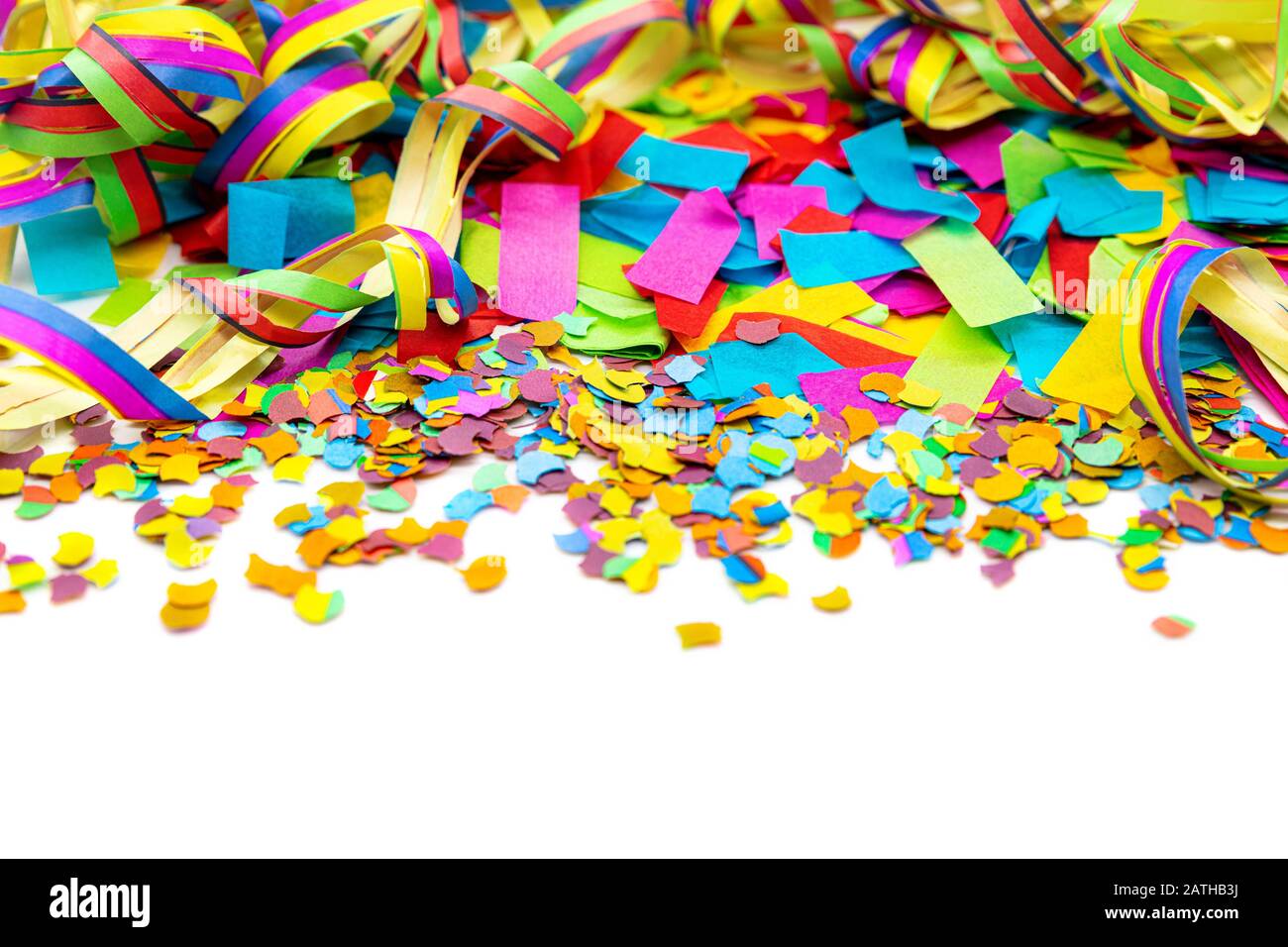 Colorful confetti and paper streamers isolated on white background ...
