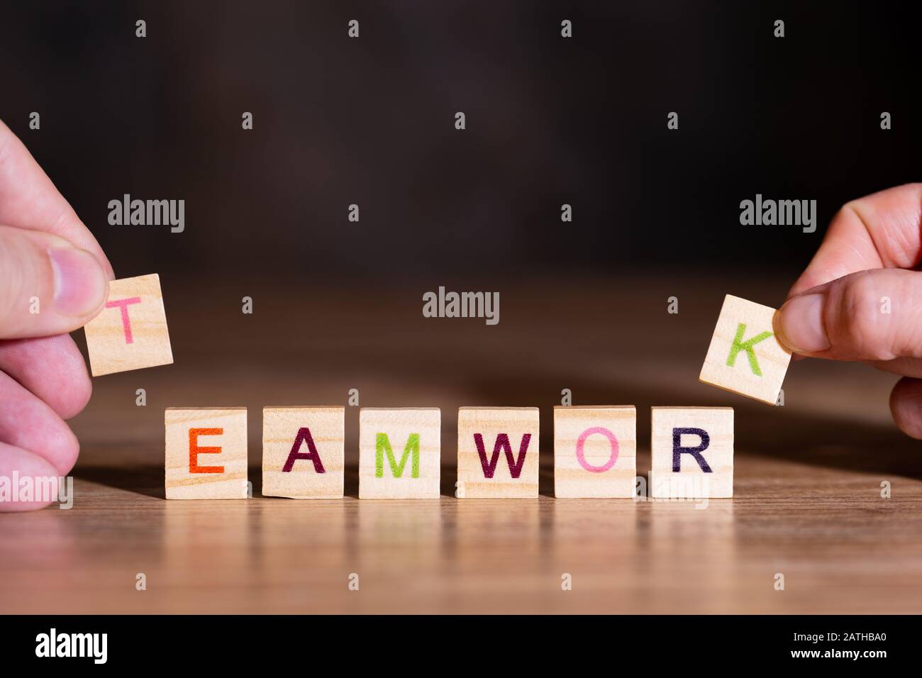 Hands put wooden blocks with letters in a row, word Teamwork Stock ...