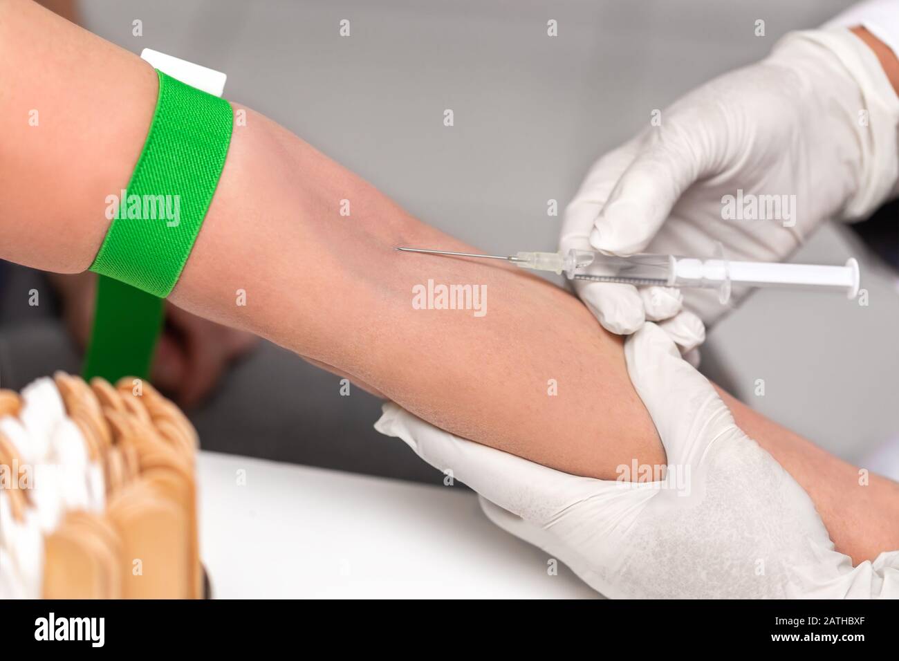 Doctor with a syringe, blood sampling or drawing or infusion on medical ...
