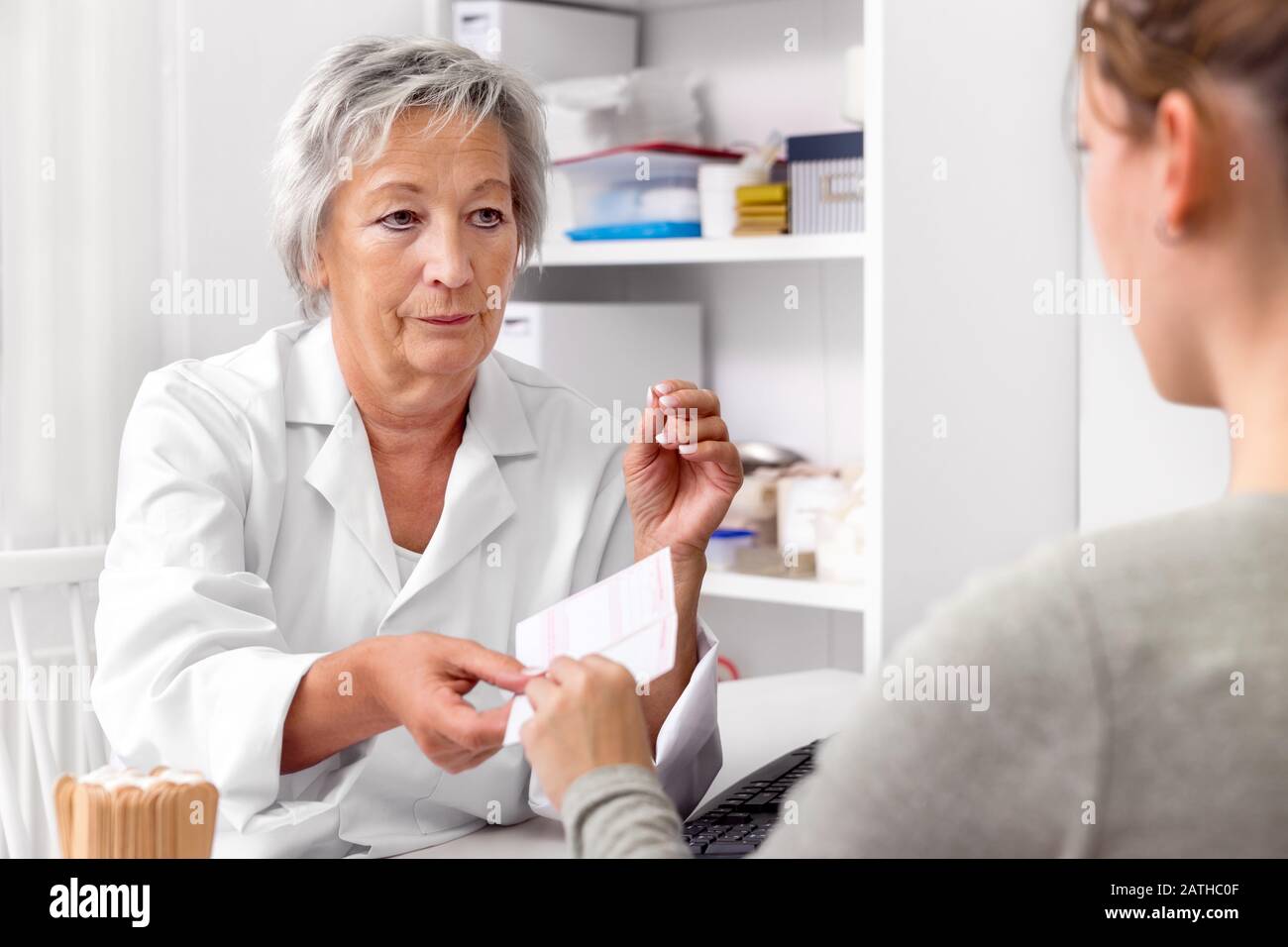 Female Doctor is giving a medical prescription to a patient, doctor´s ...