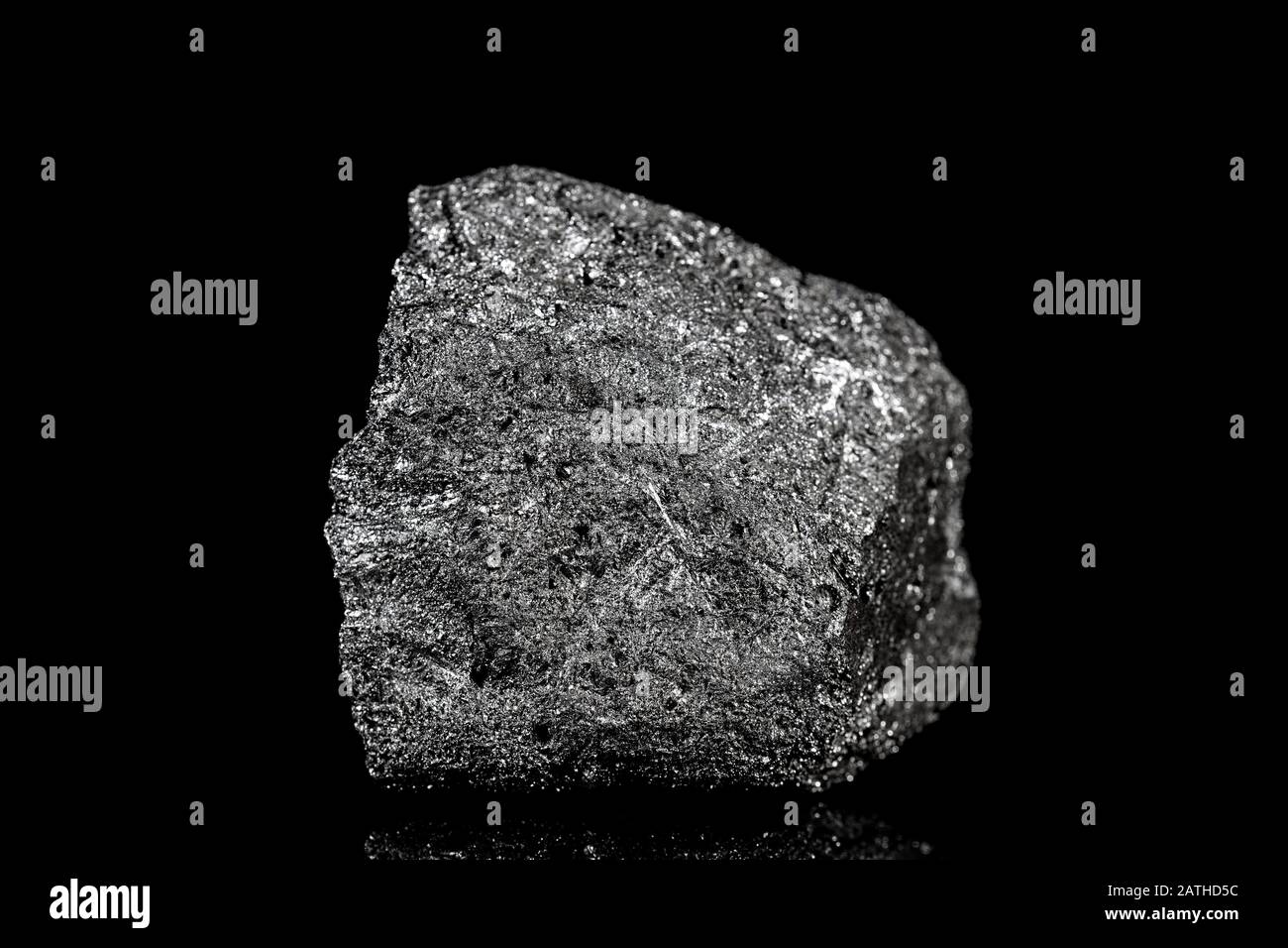 Raw and unrefined silicon element in front of black background, mining ...