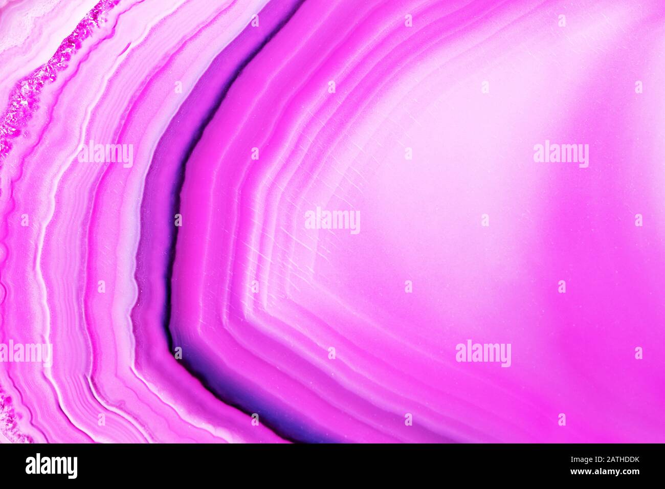 Closeup of pink banded agate mineral stone, pattern background with ...