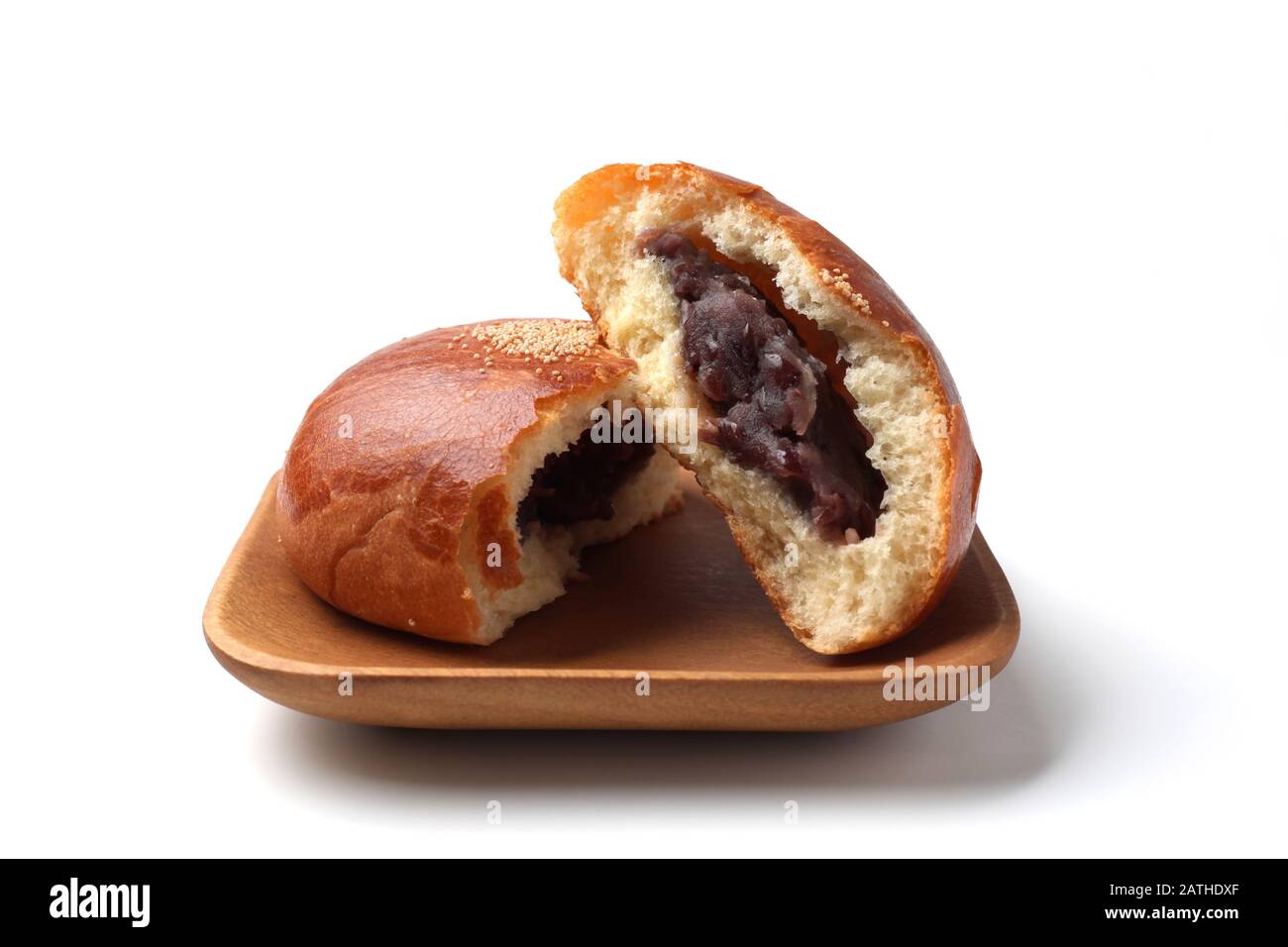 anpan round bread with azuki red beans paste closeup isolated on plate ...