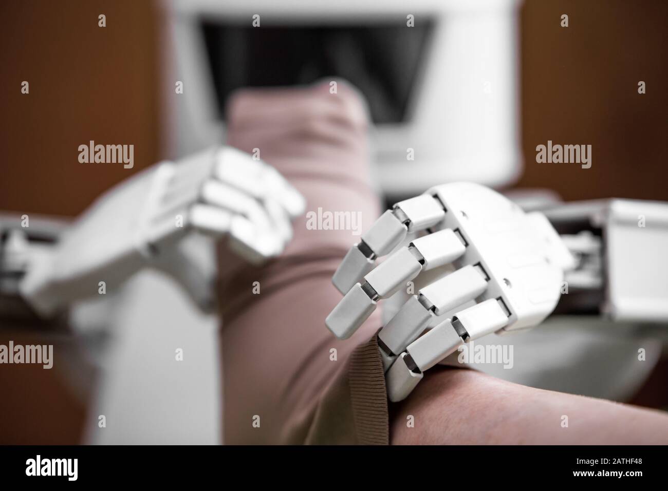 caregiver robot or medical assisted living robot is putting on a ...