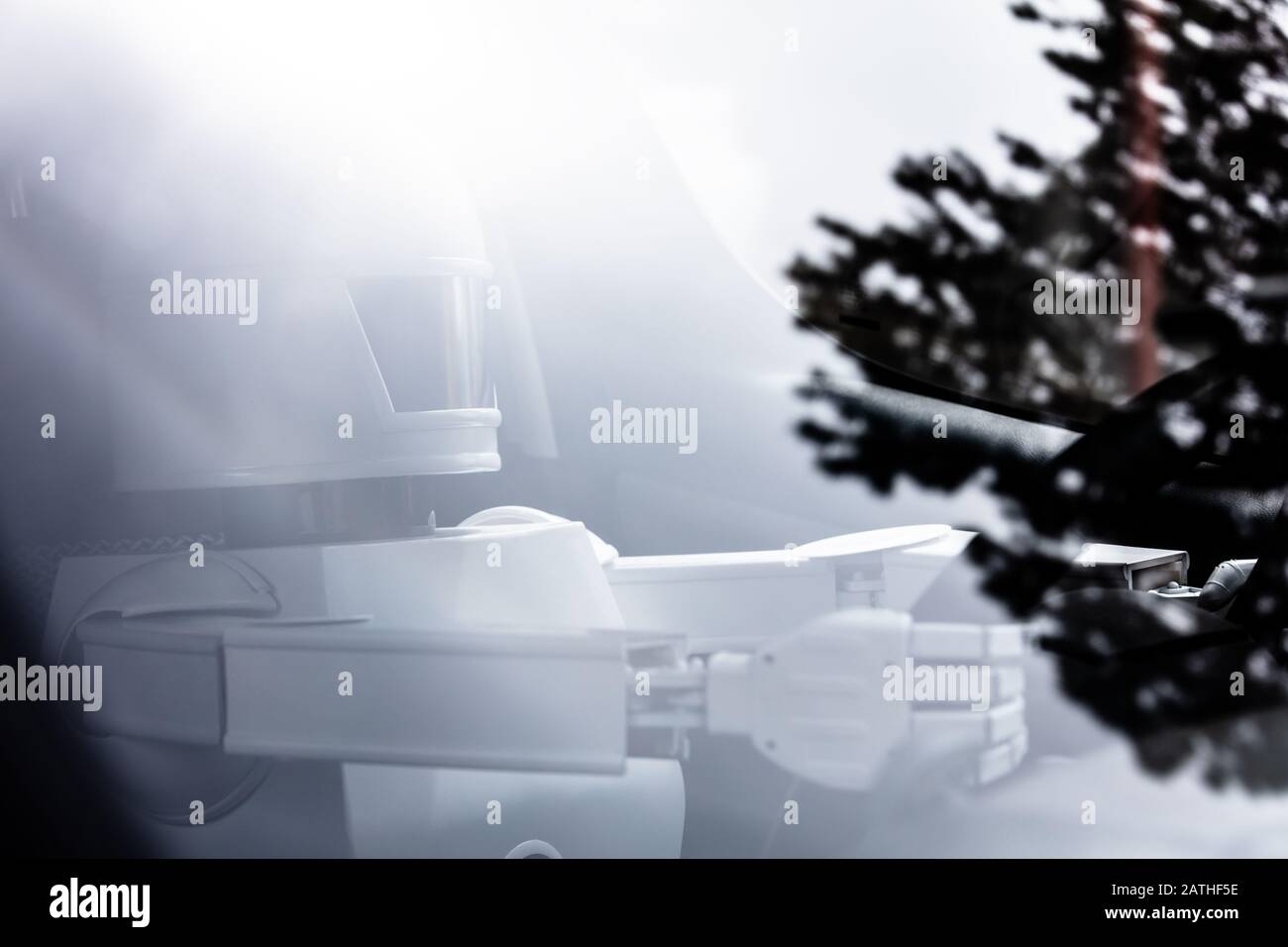 autonomous white robot is driving a car, concept driving robot or ...