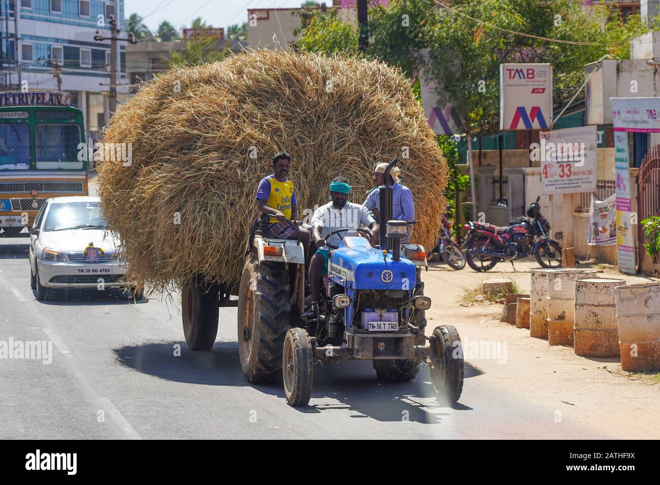 A tractor pulling an agricultural load. From a series of travel photos ...