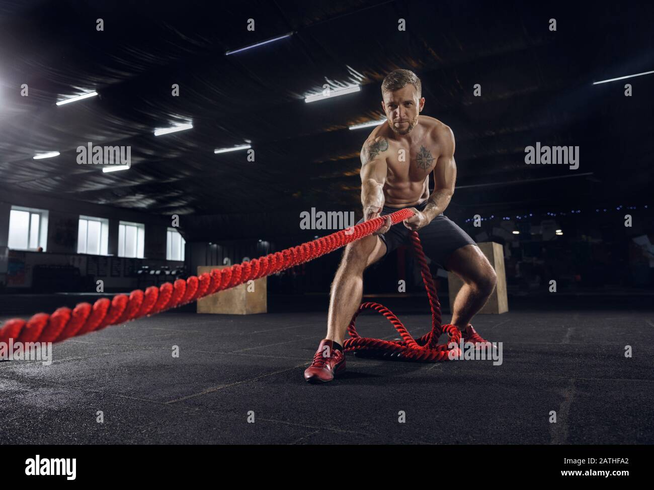 Squatting male model hi-res stock photography and images - Alamy