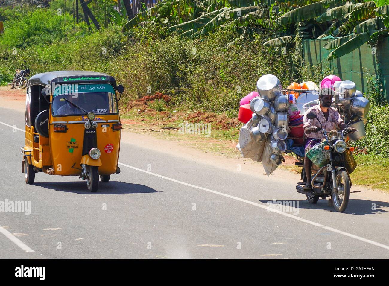 Views of riders of motorcycles and mopeds in Kerala. From a series of ...
