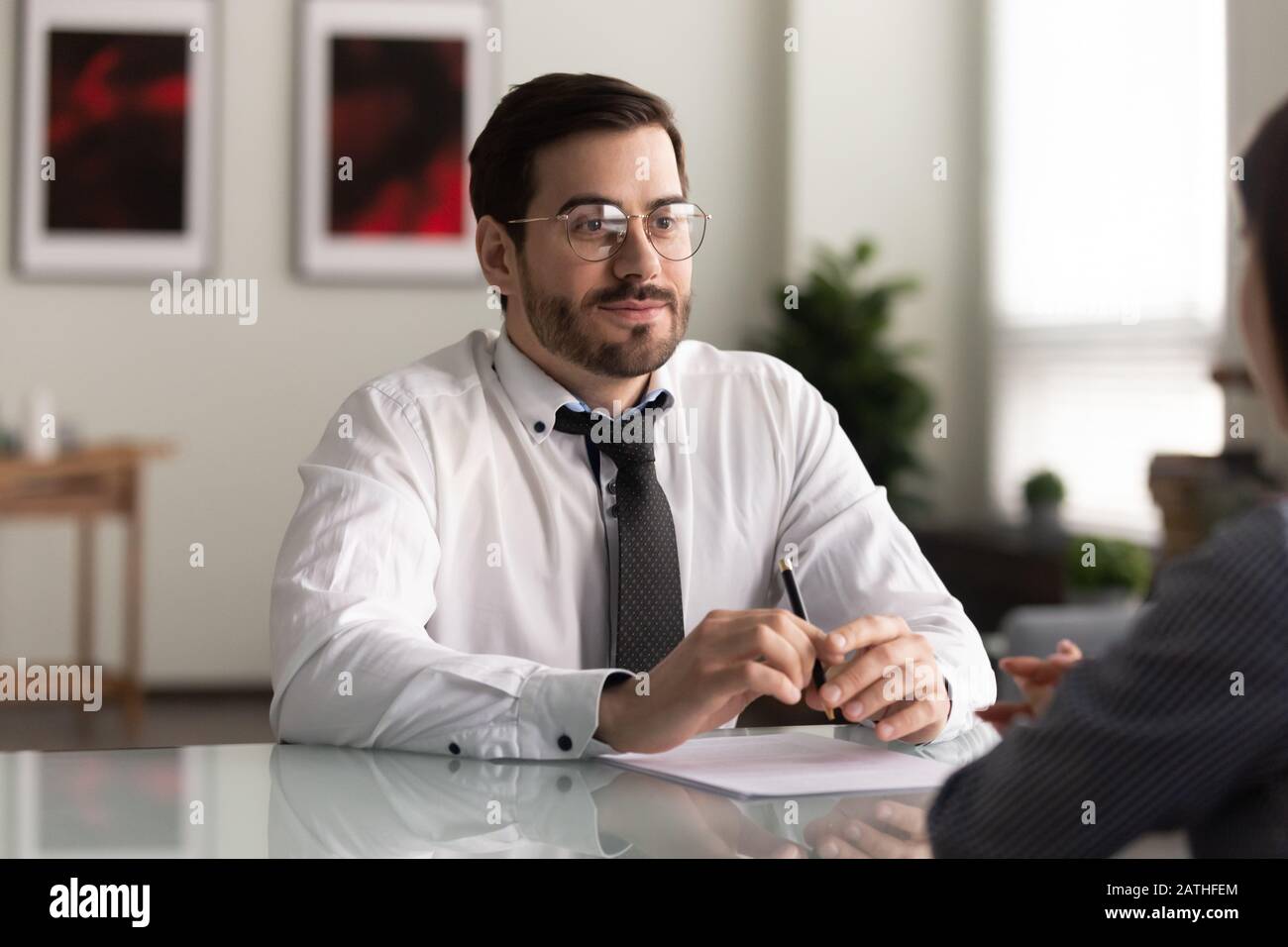 Male HR manager listens female applicant vacancy candidature Stock ...