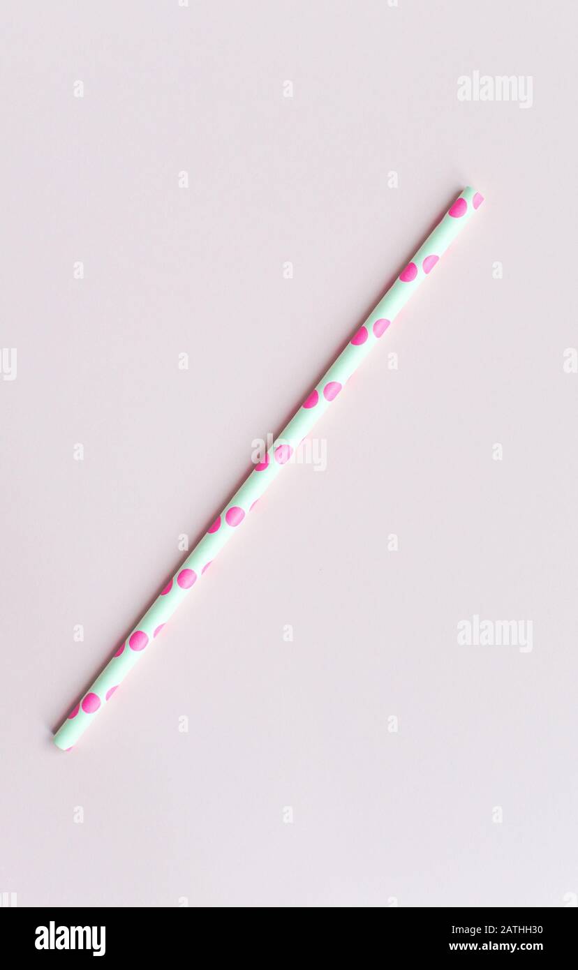 Pink straw on a pink background Stock Photo - Alamy