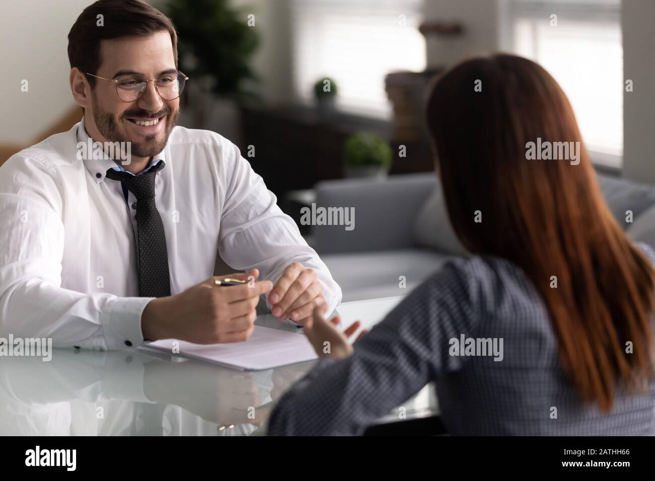 Company owner and female applicant communicating during job interview ...
